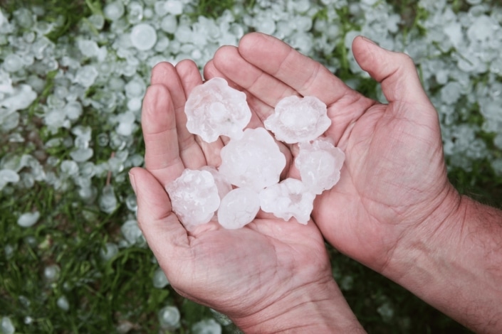 Cracking The Impact: What Size Hail Will Damage A Roof? | Rapid Roofing